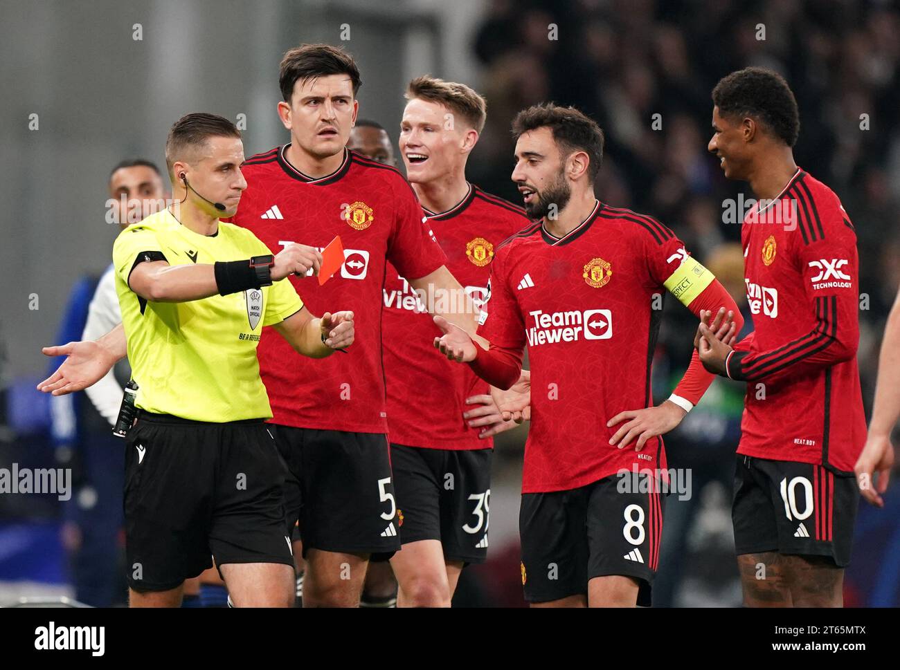 Manchester United's Marcus Rashford (right) is shown a red card during ...