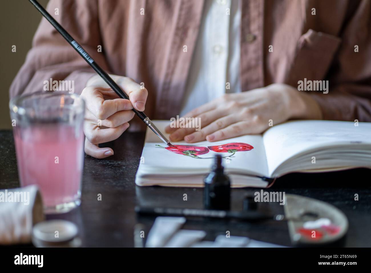 Hands of illustrator, artist, visual designer drawing colorful picture ...