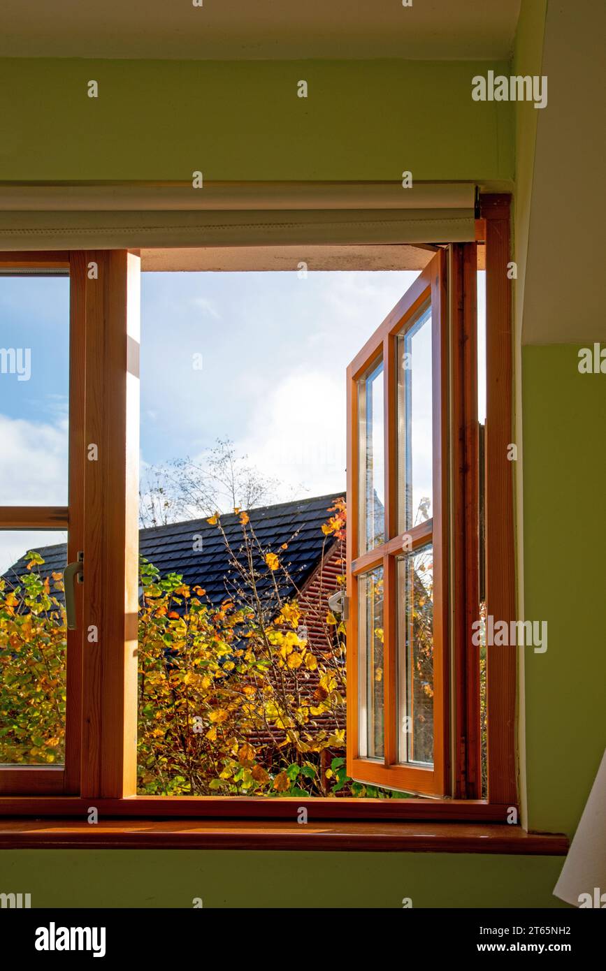 View through a Double glazed wooden window frame in the home in autumn ...