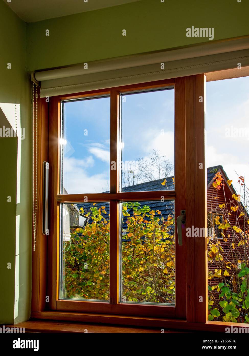 View through a Double glazed wooden window frame in the home in autumn ...