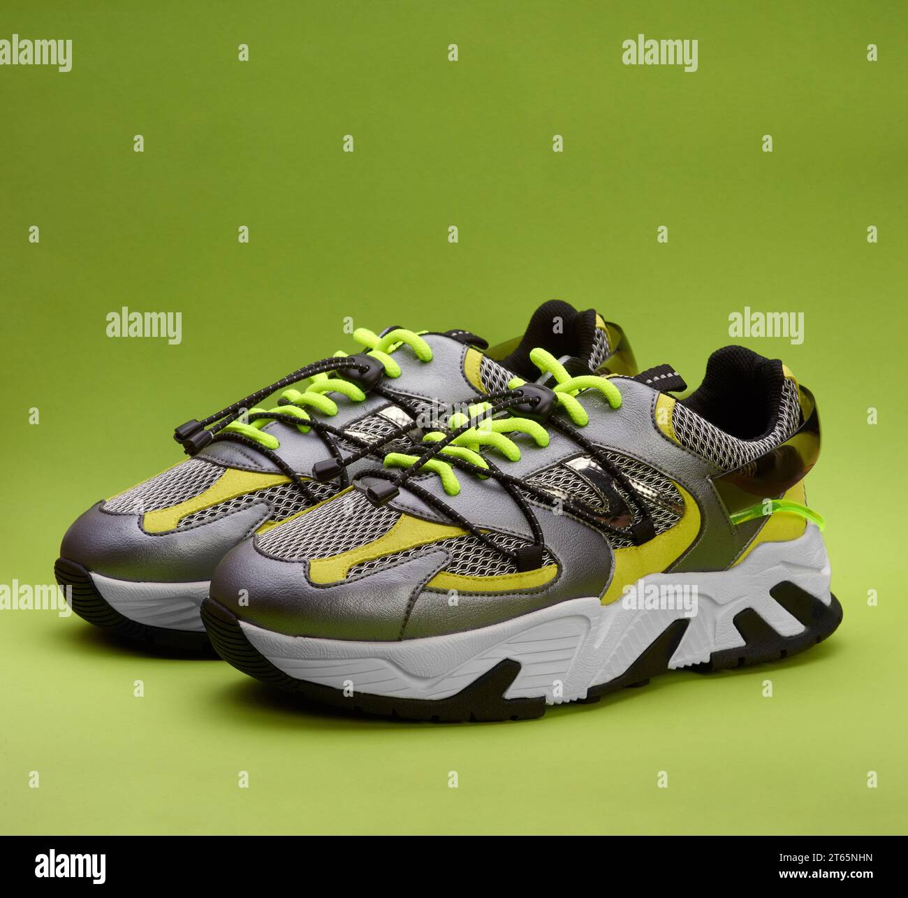 Close up view of women's fashionable metallic grey running shoes with ...