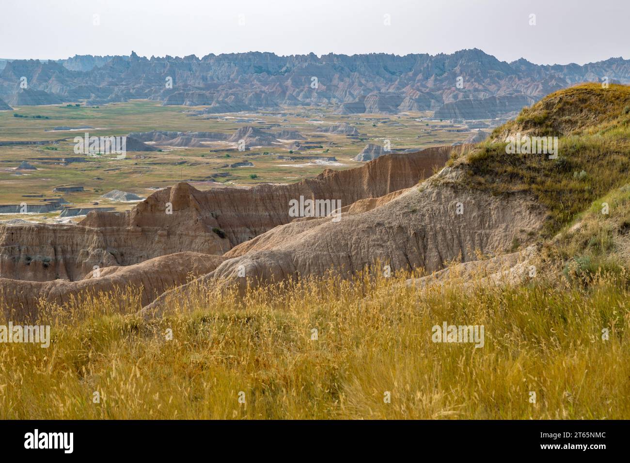 Erosion exposes colorful layers of sedimentary rock in the Badlands ...