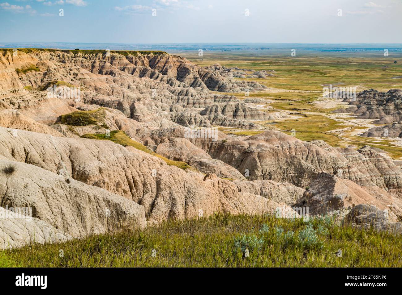 Erosion exposes colorful layers of sedimentary rock in the Badlands ...