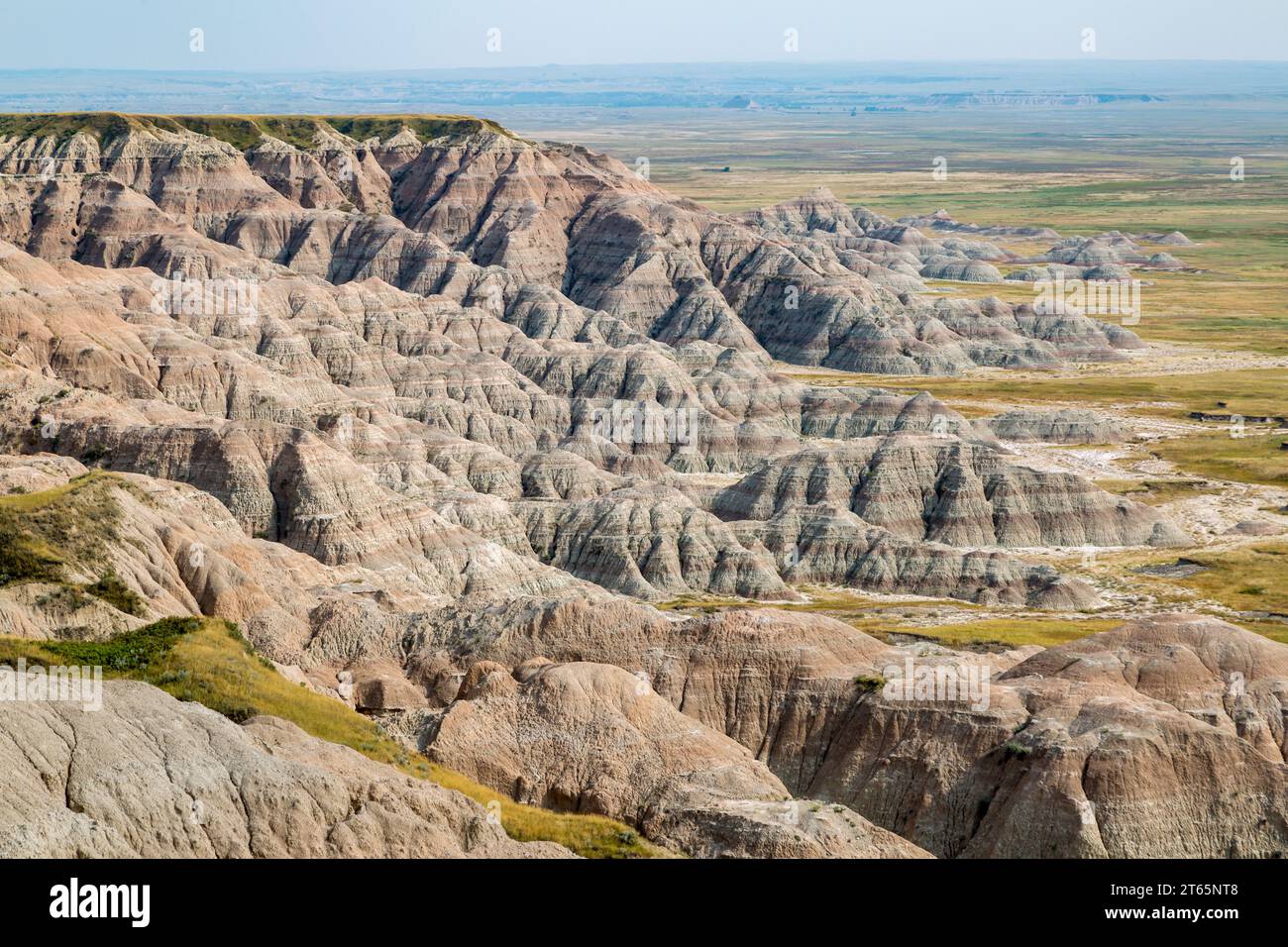 Erosion exposes colorful layers of sedimentary rock in the Badlands ...