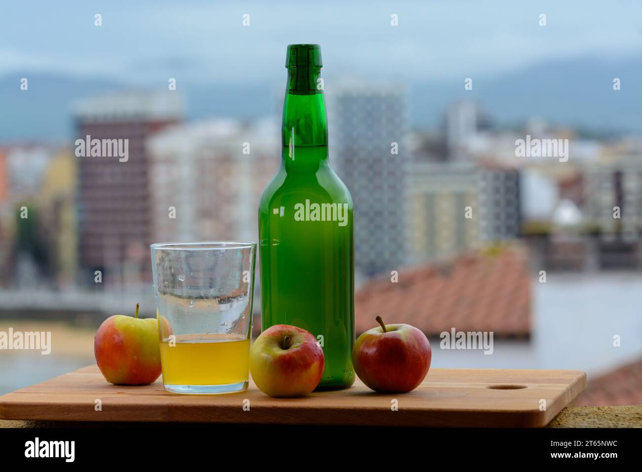 Traditional natural Asturian cider made from fermented apples in wooden ...