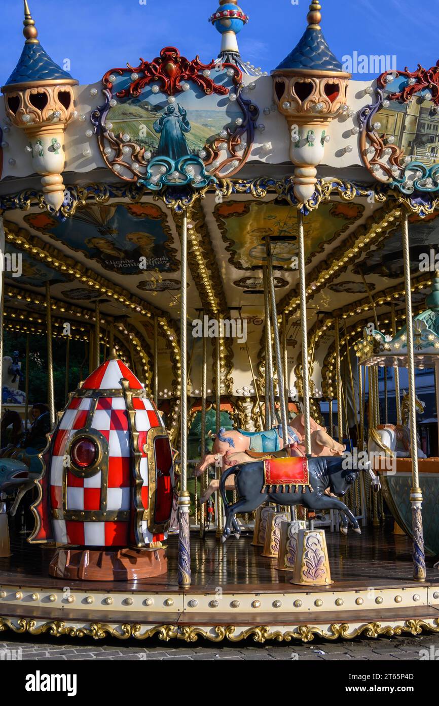 Colorful traditional old french caroussel in city park in sunny day ...