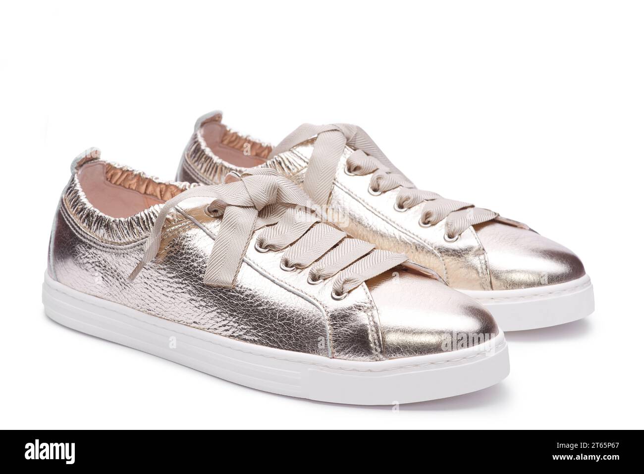 Pair of stylish women's metallic shoes with thick laces and white sole ...