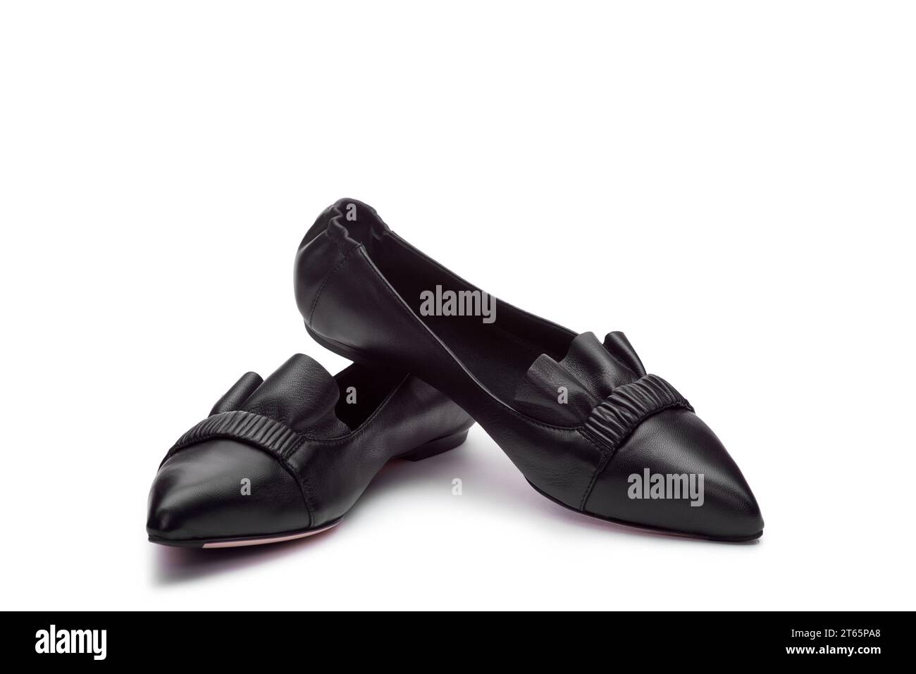 Close up shot of black pointed-toe leather ballet flats with wrinkled ...