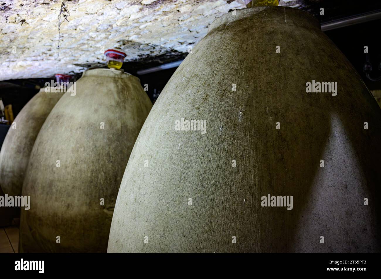 Concrete tanks eggs for fermentation process. Visit of undergrounds ...