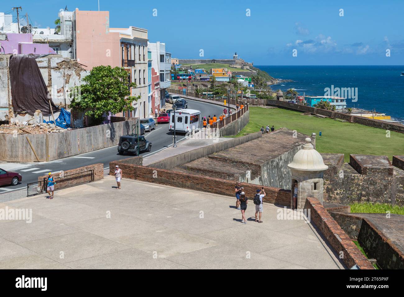 Tourists take photos at the sentry post on the northwest corner of the ...