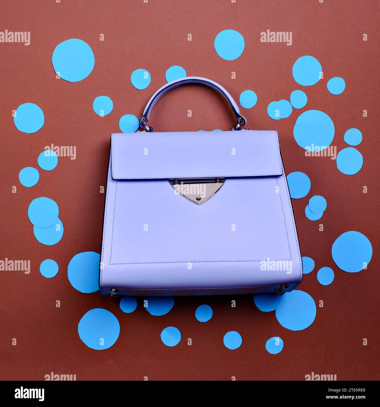 Trendy lavender leather female top-handle bag with black trim, metal ...