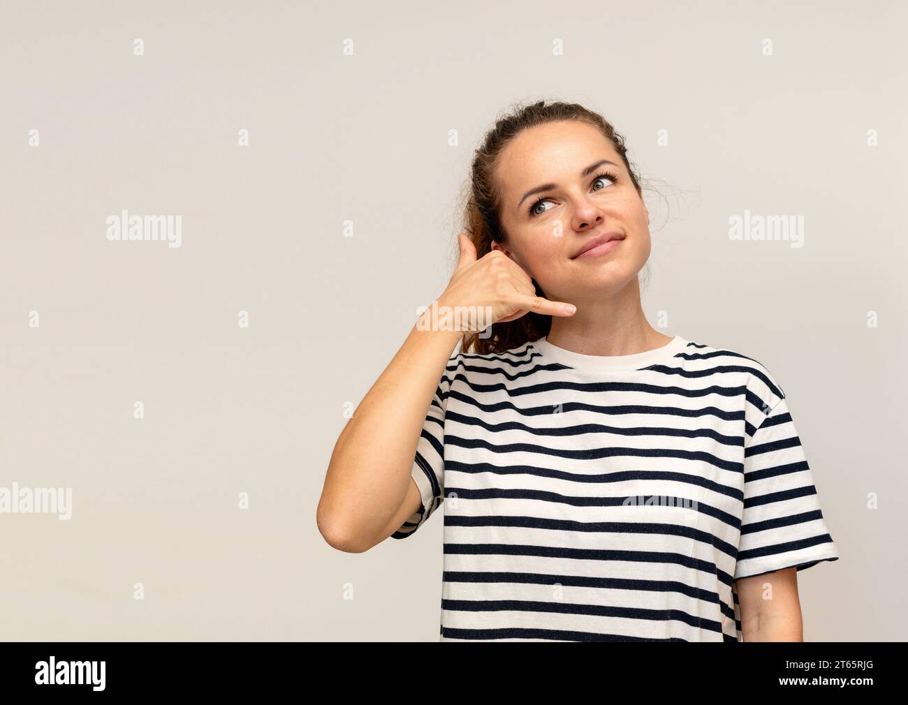 Call me gesture. Calling phone with hand gesture Stock Photo - Alamy