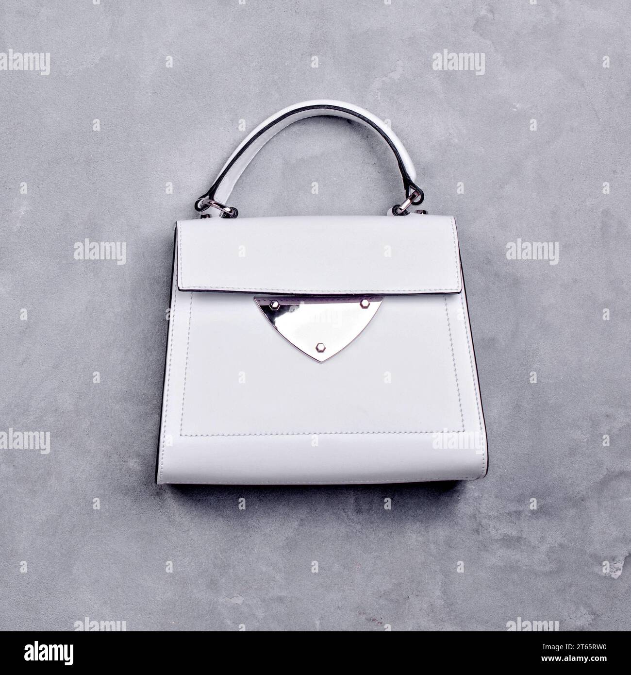 Stylish white leather women's handbag with a top handle, a black trim ...