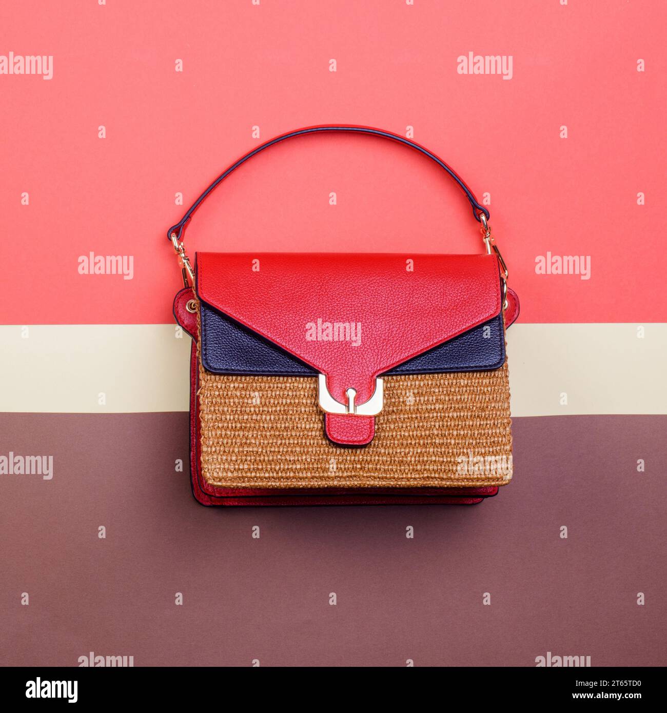 Modern women's woven handbag with red and black leather flap, gold ...