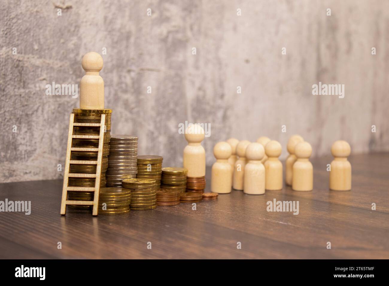 coin ladder, wooden figures, cunning and ingenuity Stock Photo - Alamy