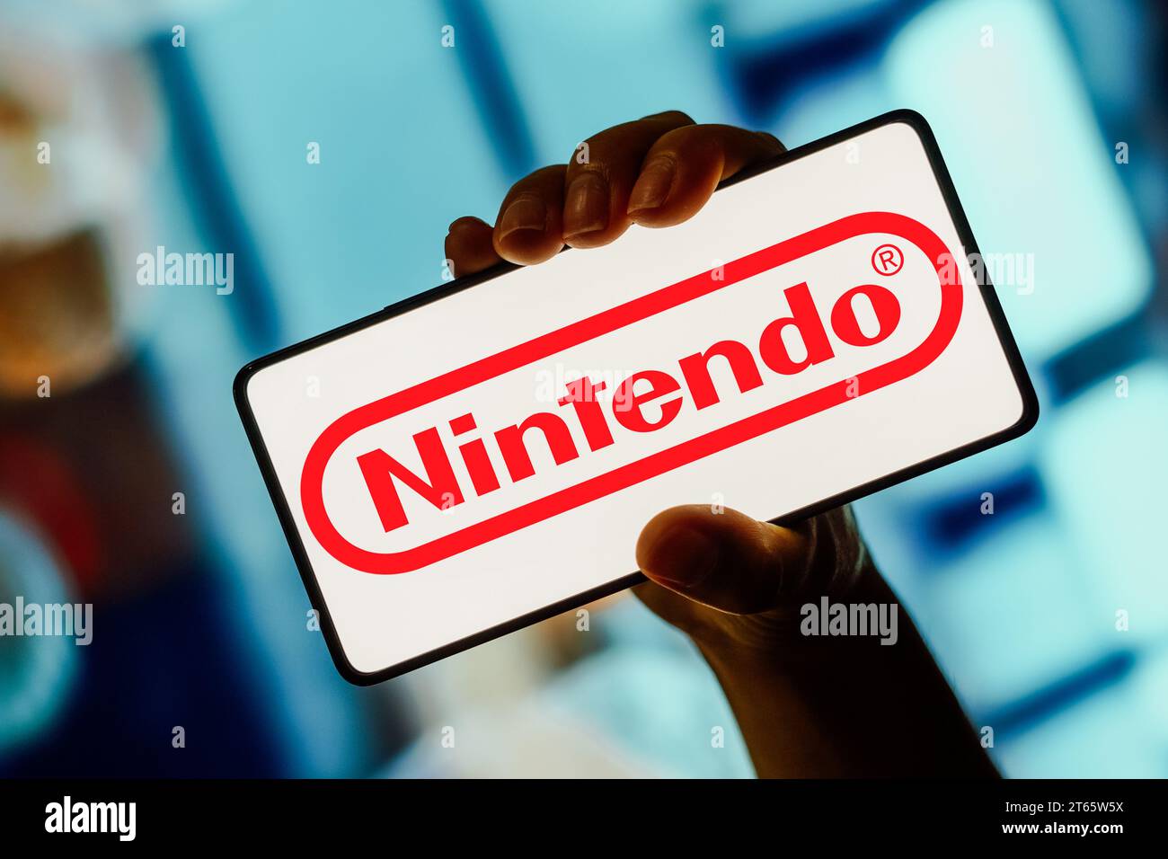 In this photo illustration, the Nintendo logo is displayed on a ...