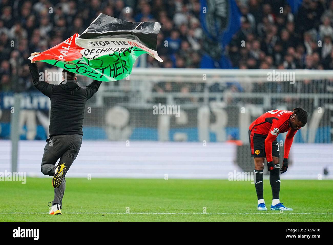 Pitch invader runs on to the pitch during the match hi-res stock ...