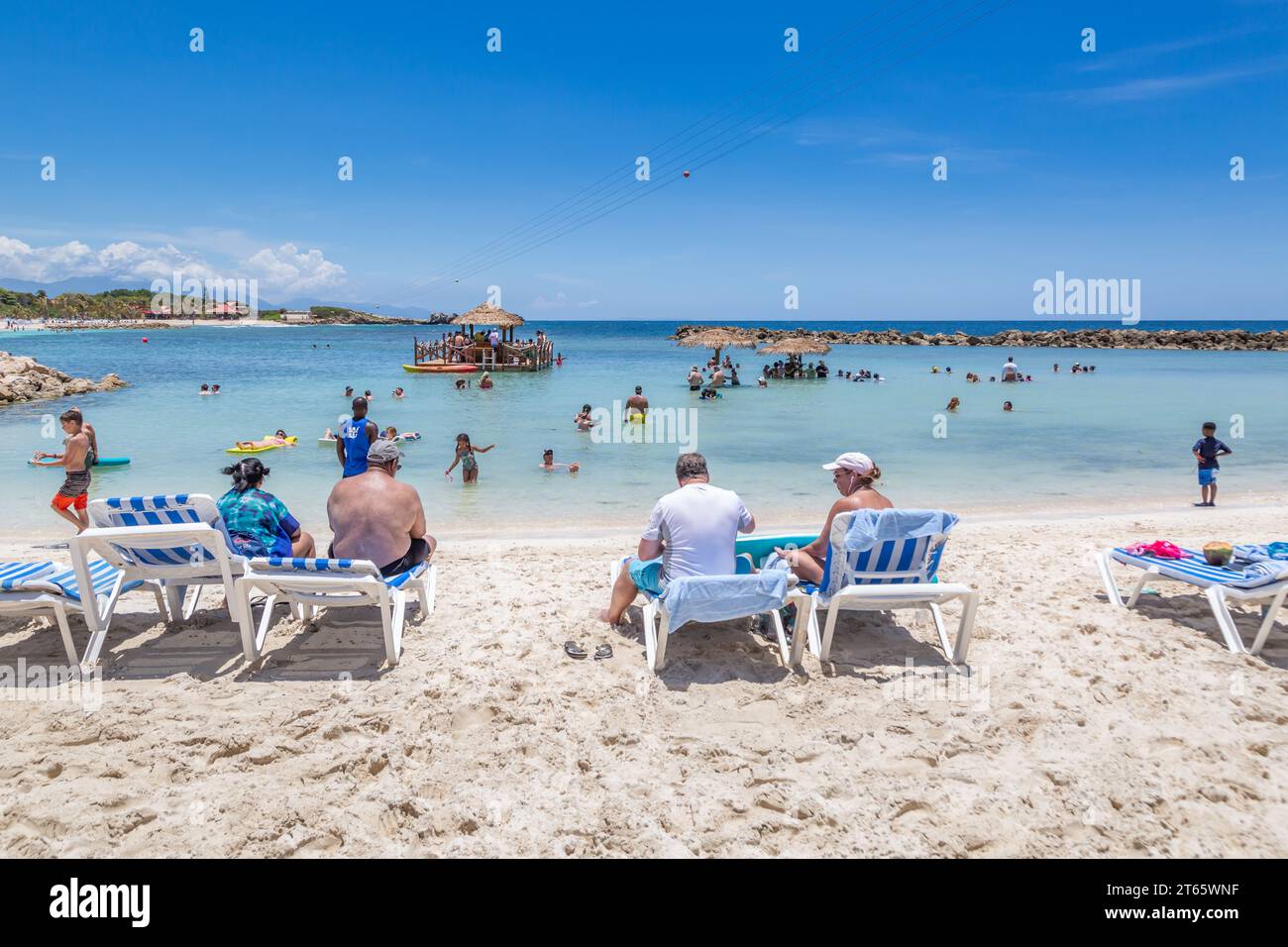 Cruise passengers on floating beach bar platform at Adrenaline Beach on ...