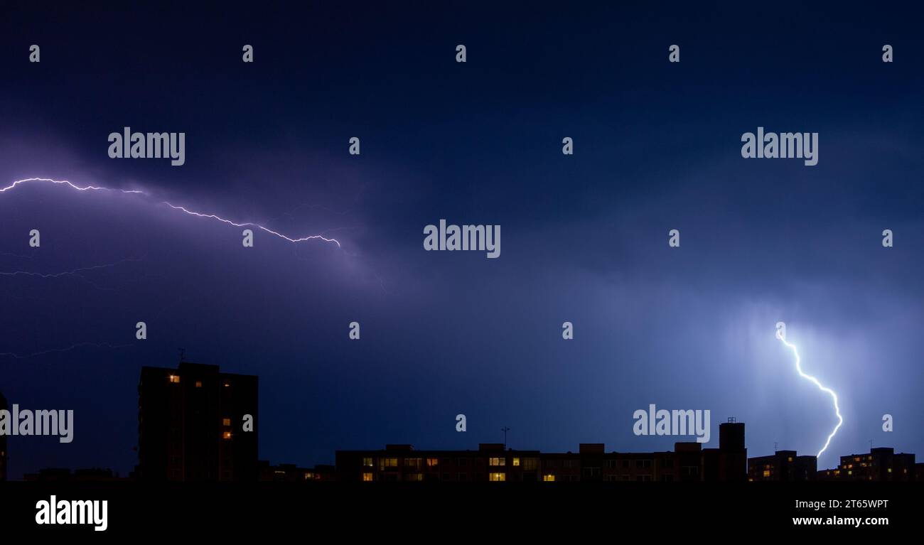 night lightning bolts, bolts over the city, dramatic scene on the night sky Stock Photo - Alamy