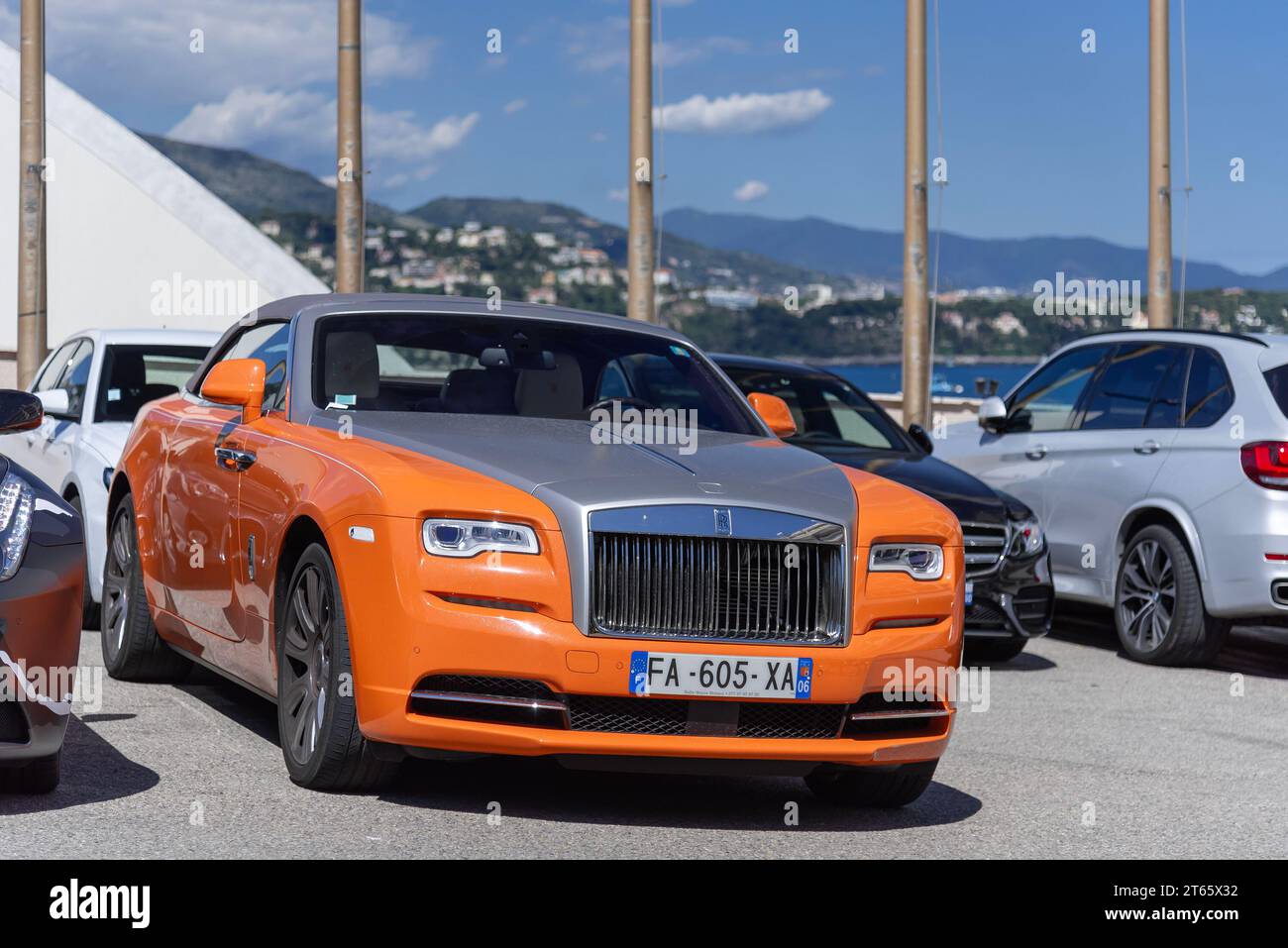 Monaco, Monaco - Orange Rolls-Royce Dawn parked in a street Stock Photo ...