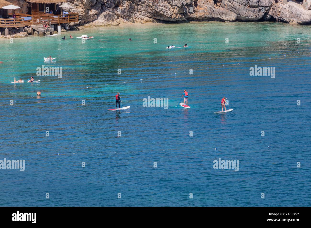 Cruise ship passengers riding on paddleboards at Royal Caribbean's ...