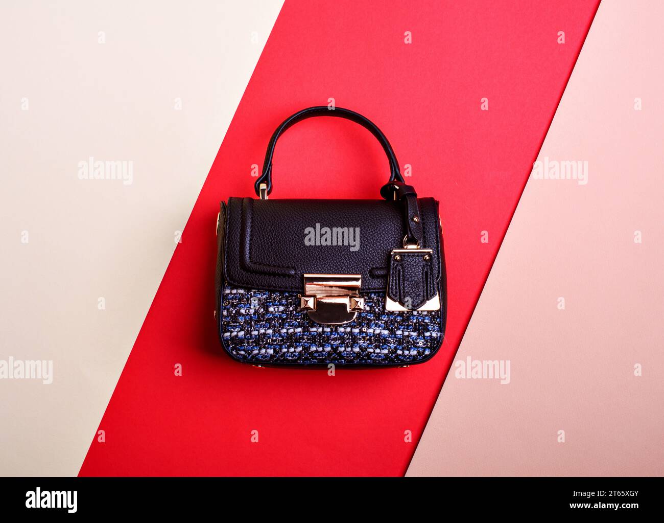 Modern female top-handle bag in black leather and multicolored textile ...