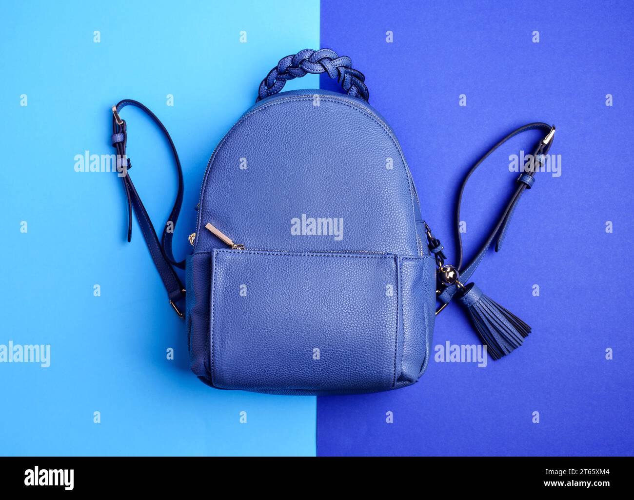 Modern royal blue leather backpack with zipped pocket with an original ...