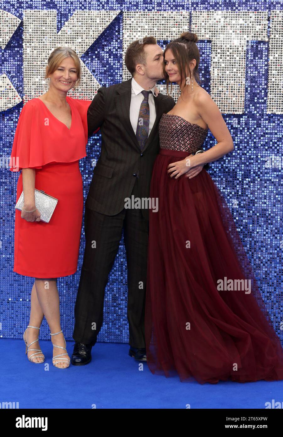 Taron Egerton with mother Christine Egerton (L) and partner Emily ...