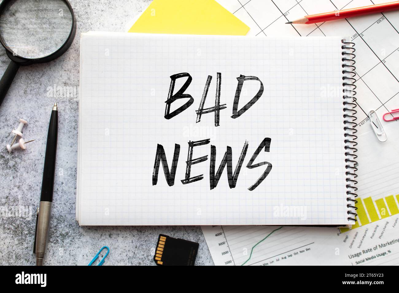 Bad News, Newspaper roll with white background Stock Photo - Alamy