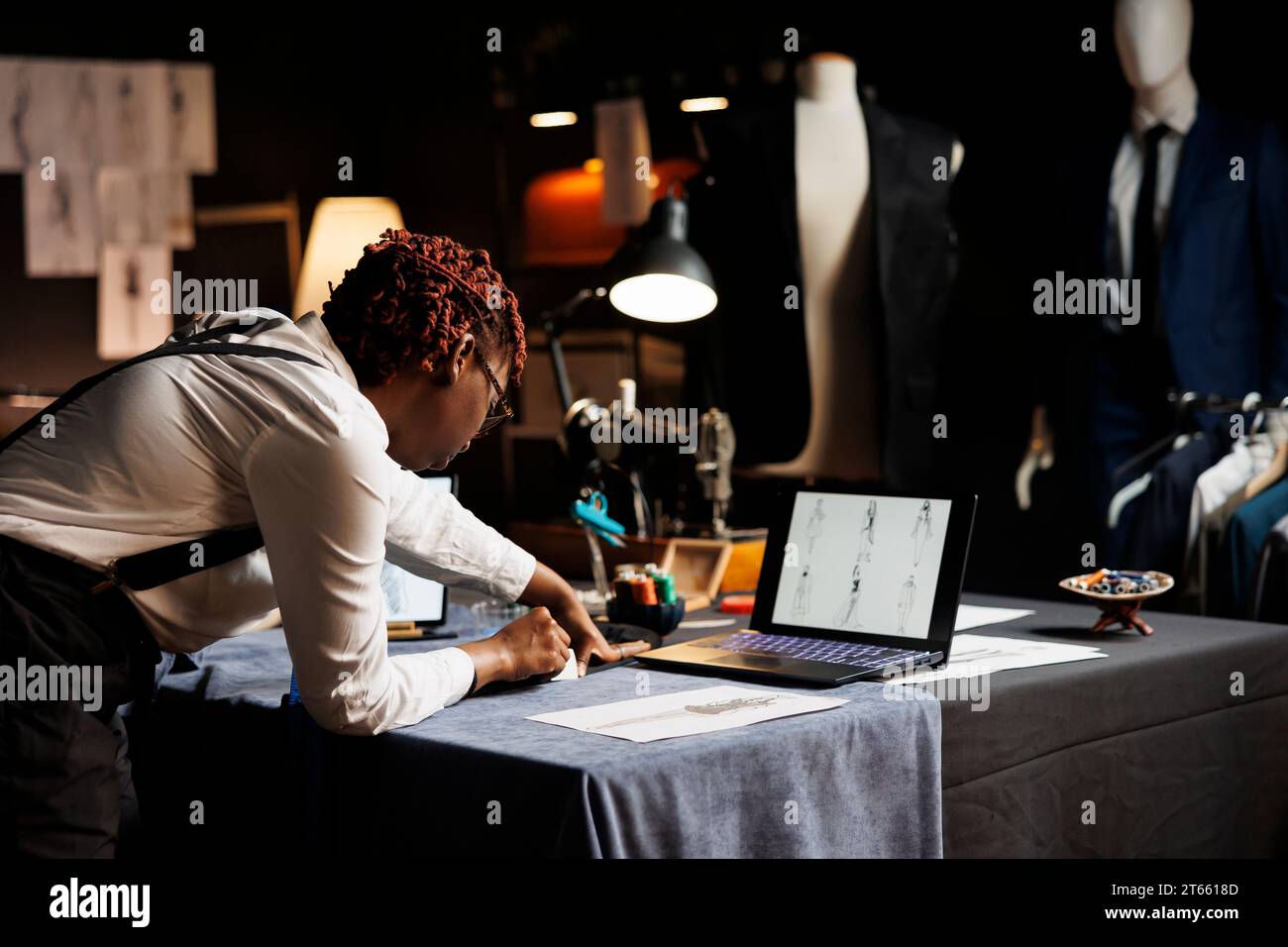 Professional seamstress focused on finishing customer comissioned suit ...