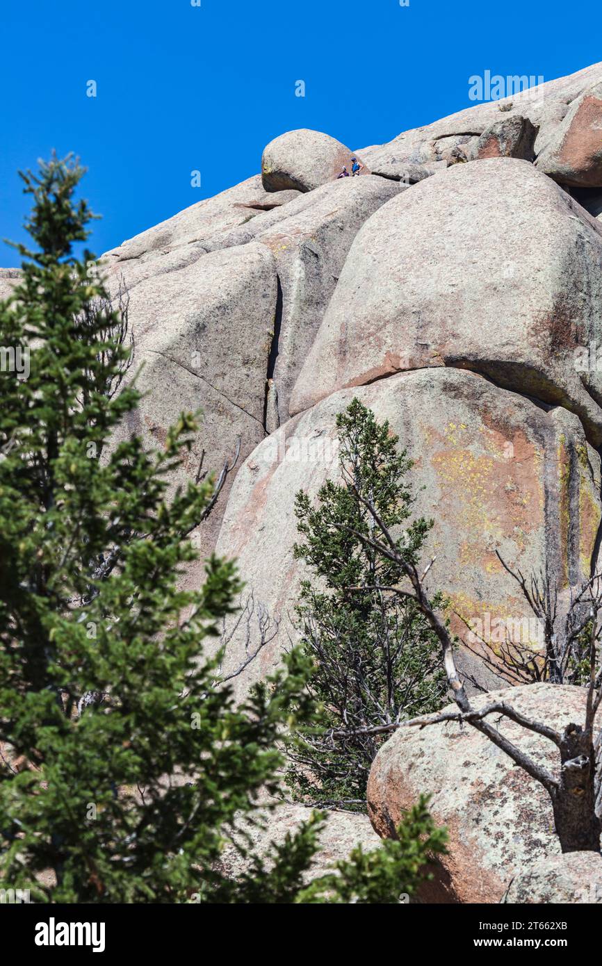 Man and woman rock climbing in the Vedauwoo Recreation Area of Medicine ...