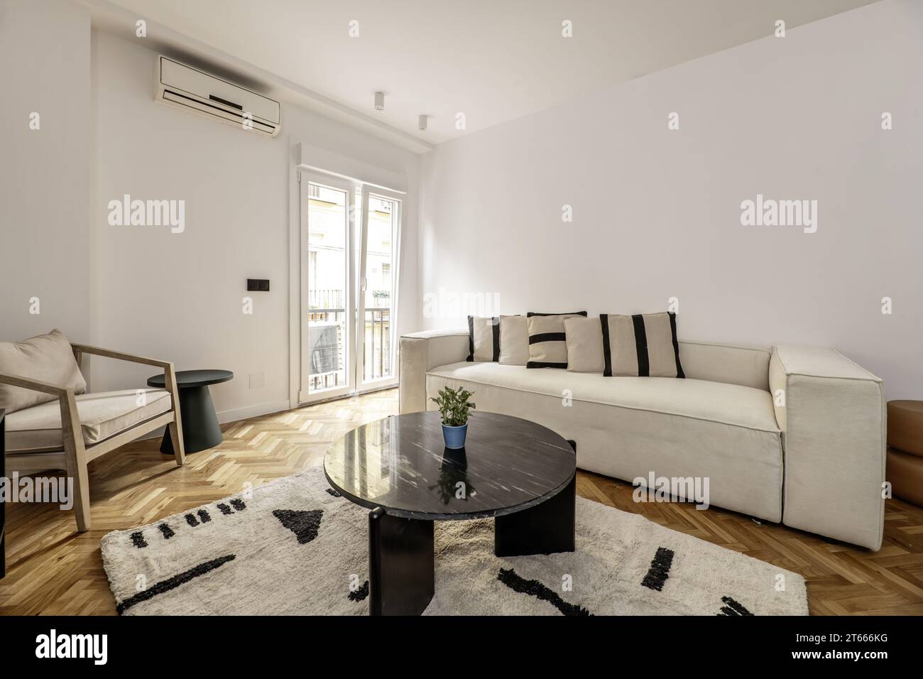 Newly decorated modern living room with a circular marble coffee table ...