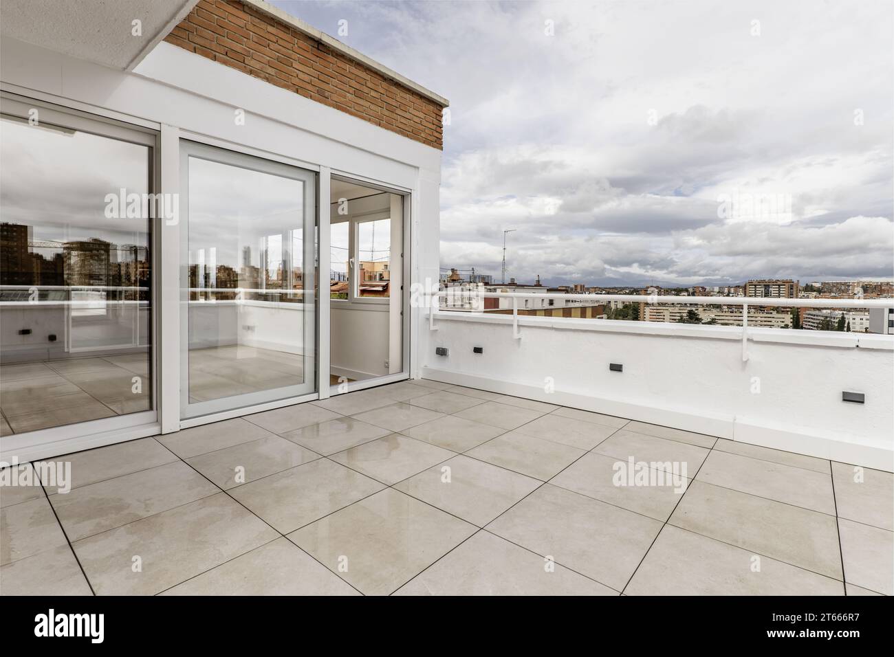 Terrace with white stoneware floor, large window with three aluminum ...