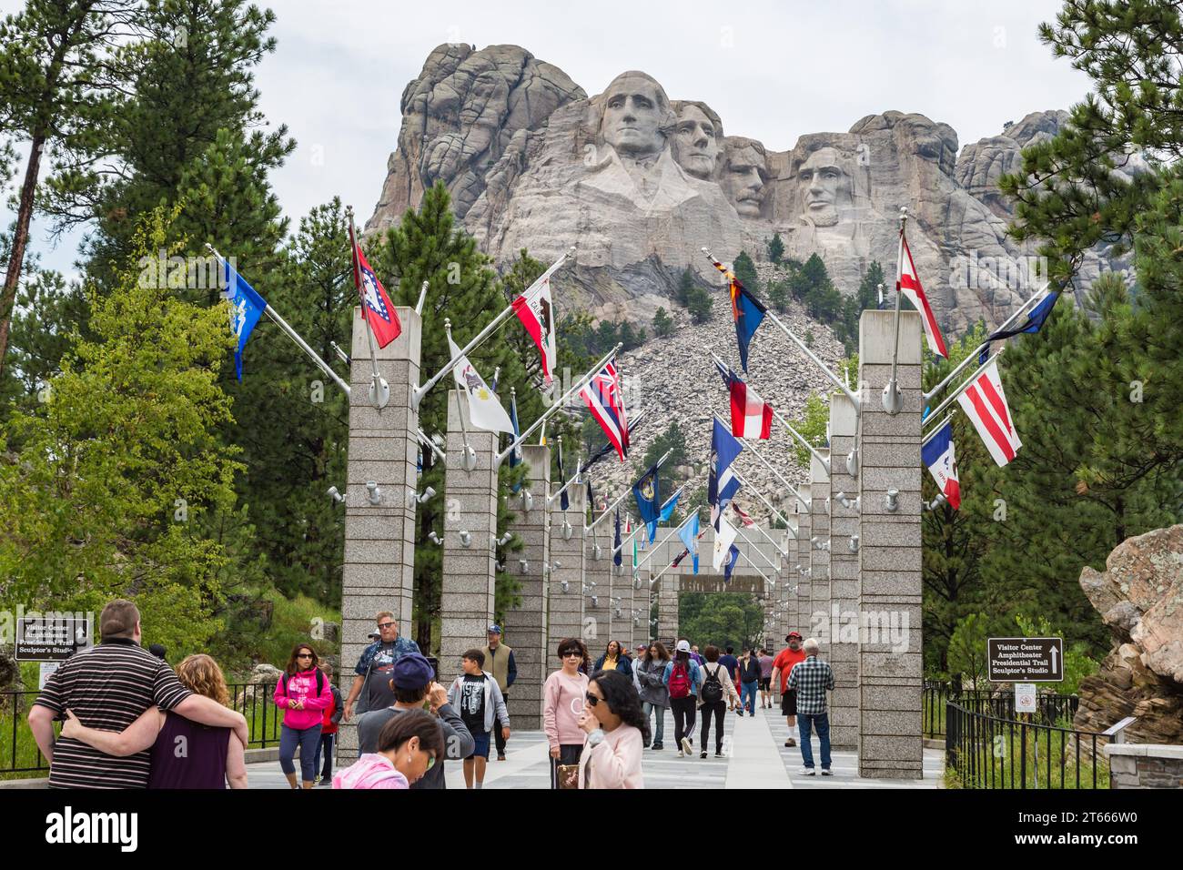 Tourists admire susts of George Washington, Thomas Jefferson, Theodore ...