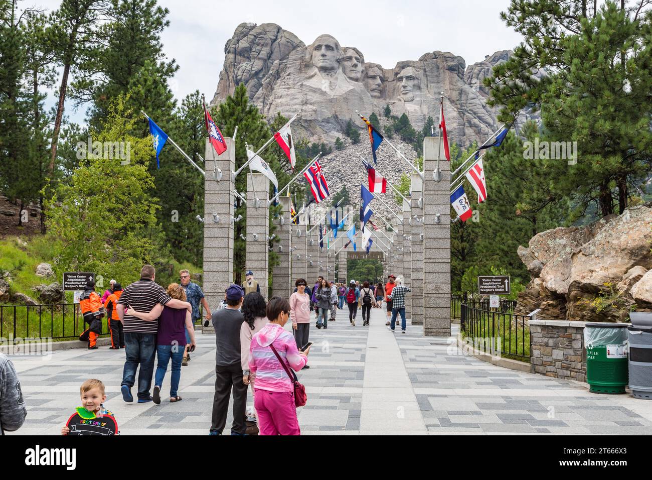 Tourists admire susts of George Washington, Thomas Jefferson, Theodore ...