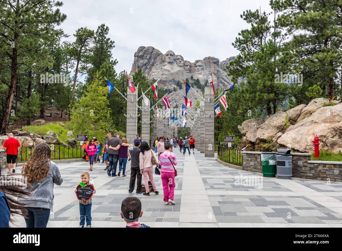 Tourists admire susts of George Washington, Thomas Jefferson, Theodore ...
