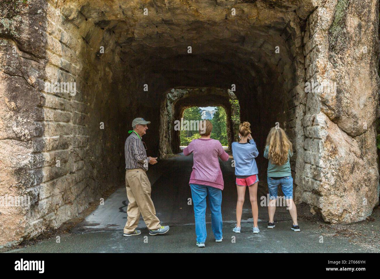 Tourists taking photos of the carved granite busts of George Washington ...