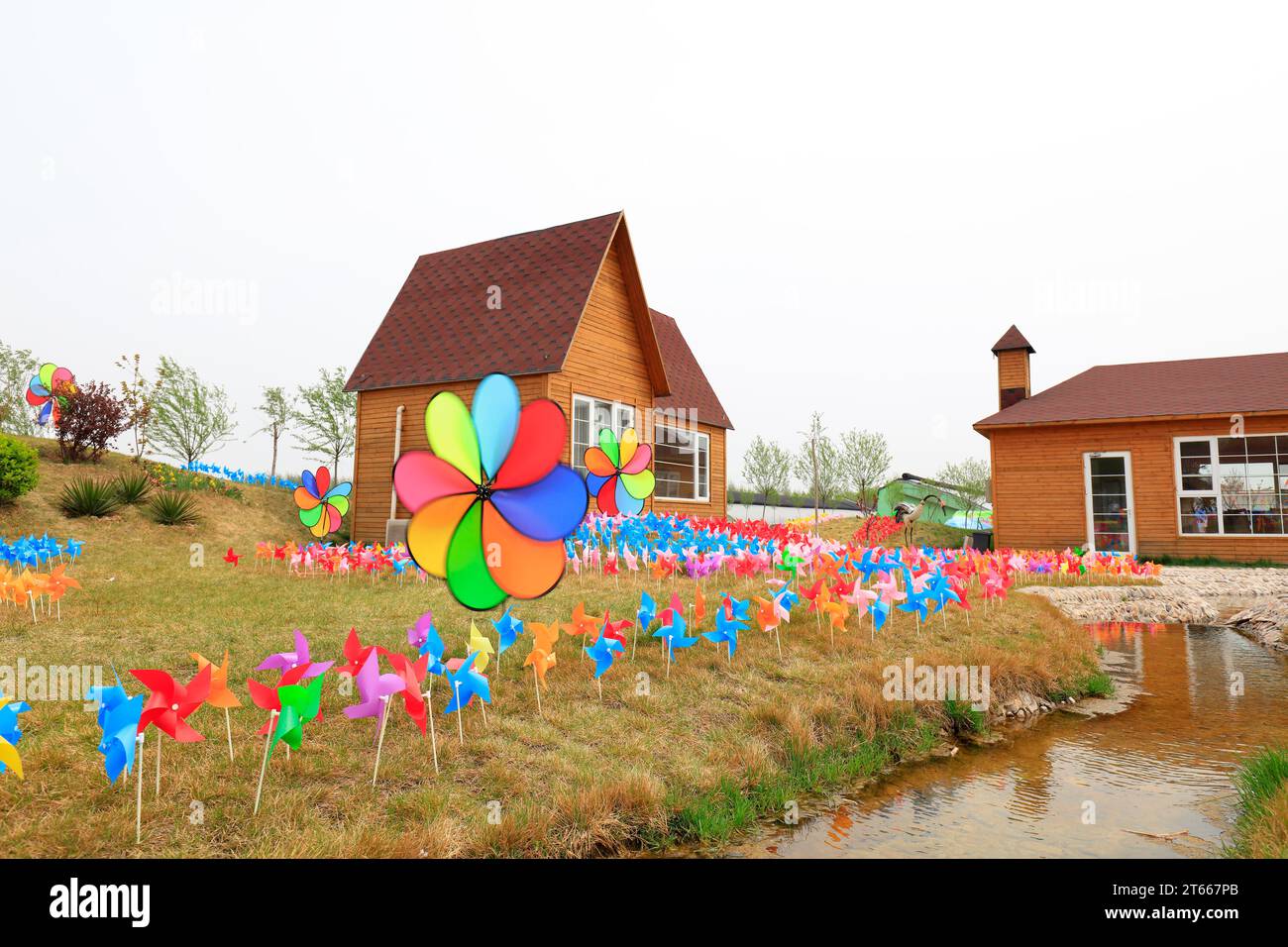 Colorful windmills and cabin pools Stock Photo - Alamy