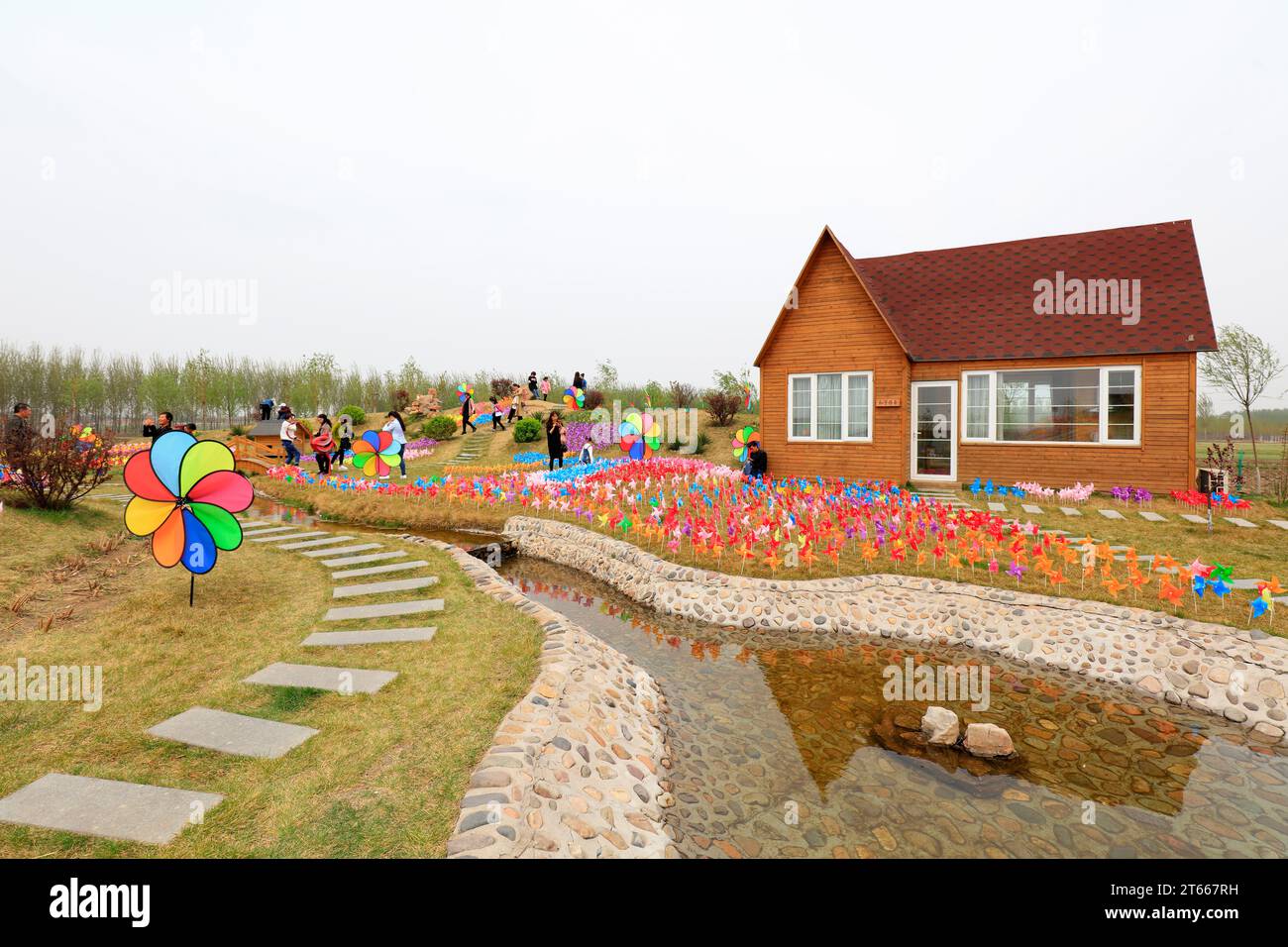 Colorful windmills and cabin pools Stock Photo - Alamy