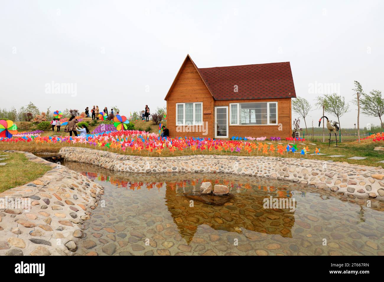 Colorful windmills and cabin pools Stock Photo - Alamy