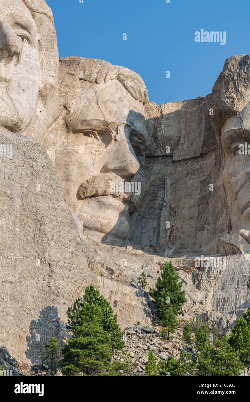 Close up of the carved granite bust of Theodore Teddy Roosevelt at Mount Rushmore National ...