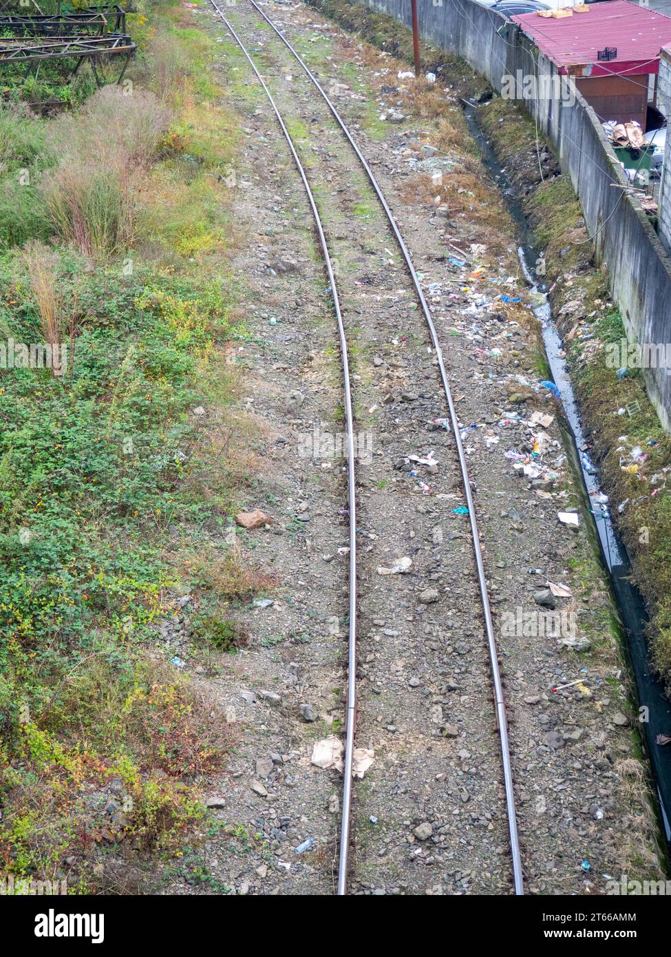 Garbage on the railway Rails and waste. Polluted environment in the ...