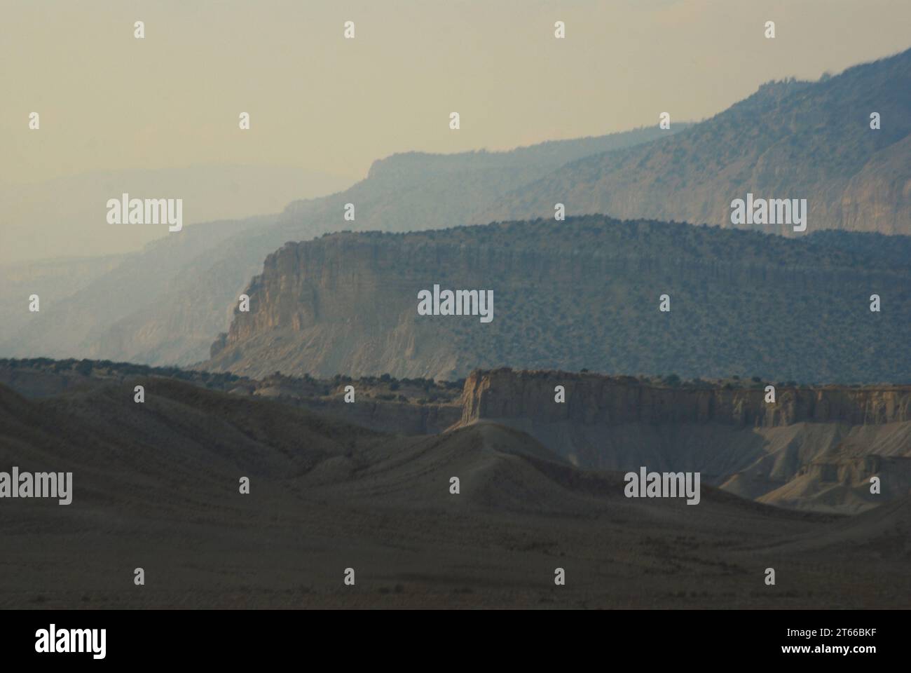 Forest fires create a smokey haze over a range of mountains in Central ...