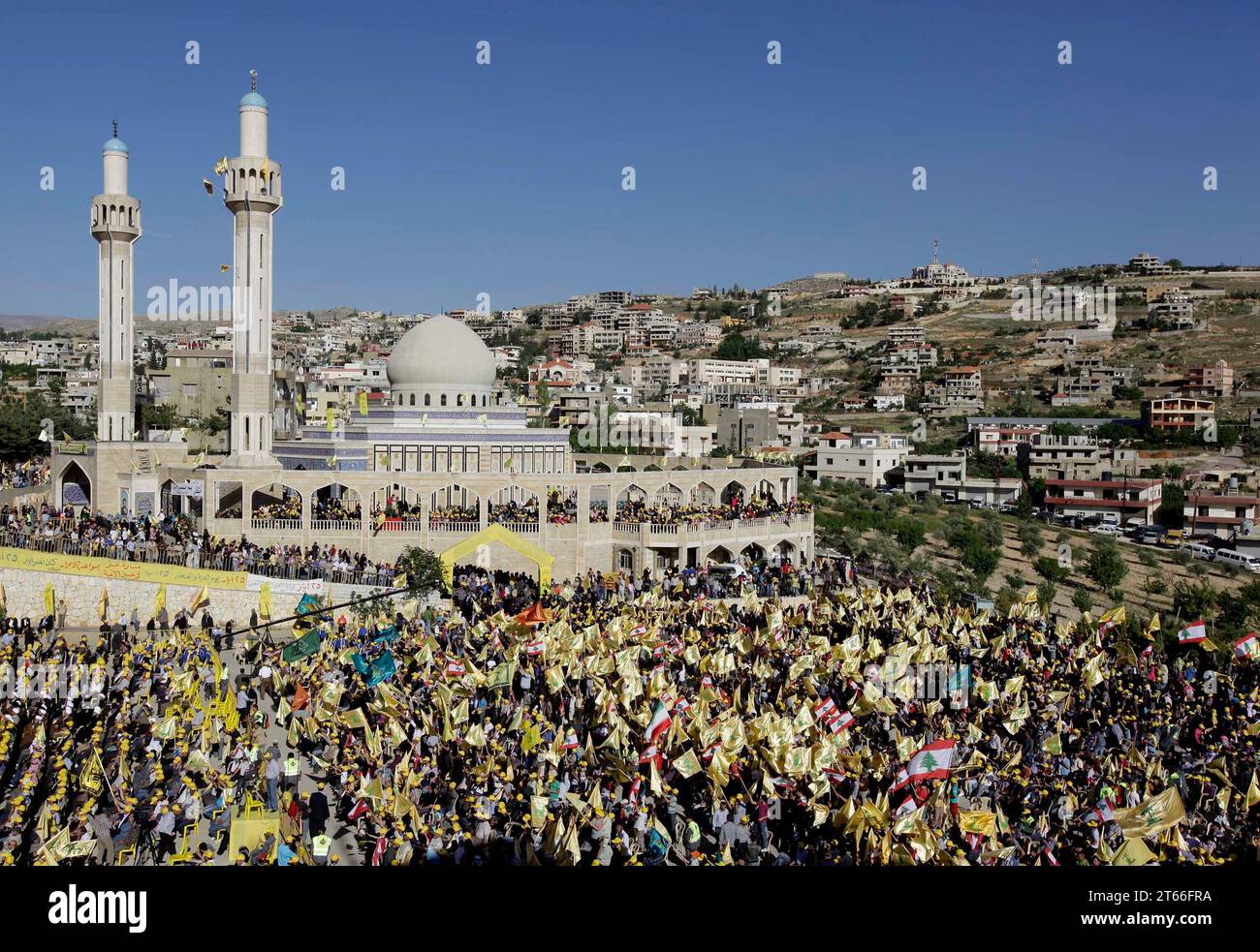 FILE - Hezbollah supporters wave Hezbollah and Lebanese flags during a ...