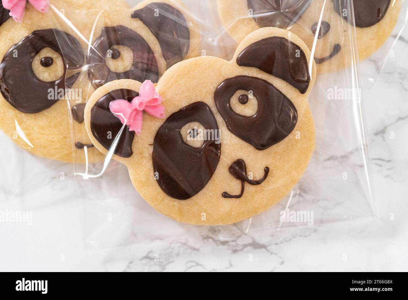 Panda shaped shortbread cookies with chocolate icing Stock Photo - Alamy