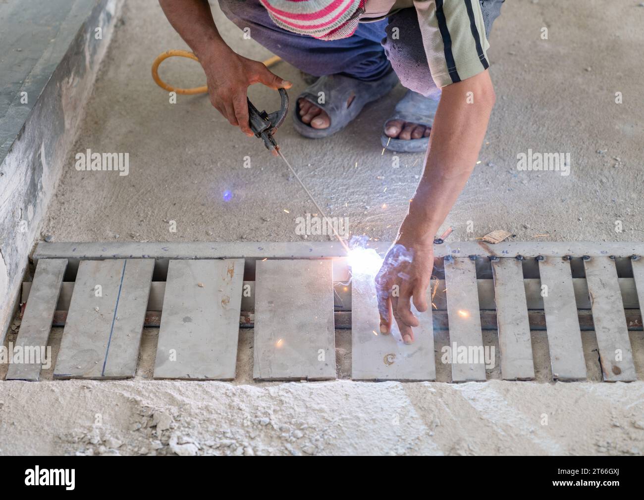 Worker welding stainless steel grill without personal protective ...