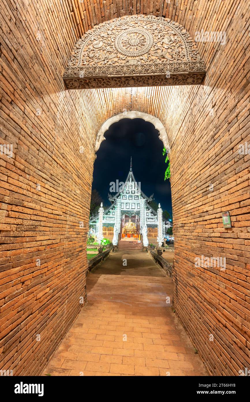Tall, narrow, arched, short tunnel,lined with red brickwork,leading ...