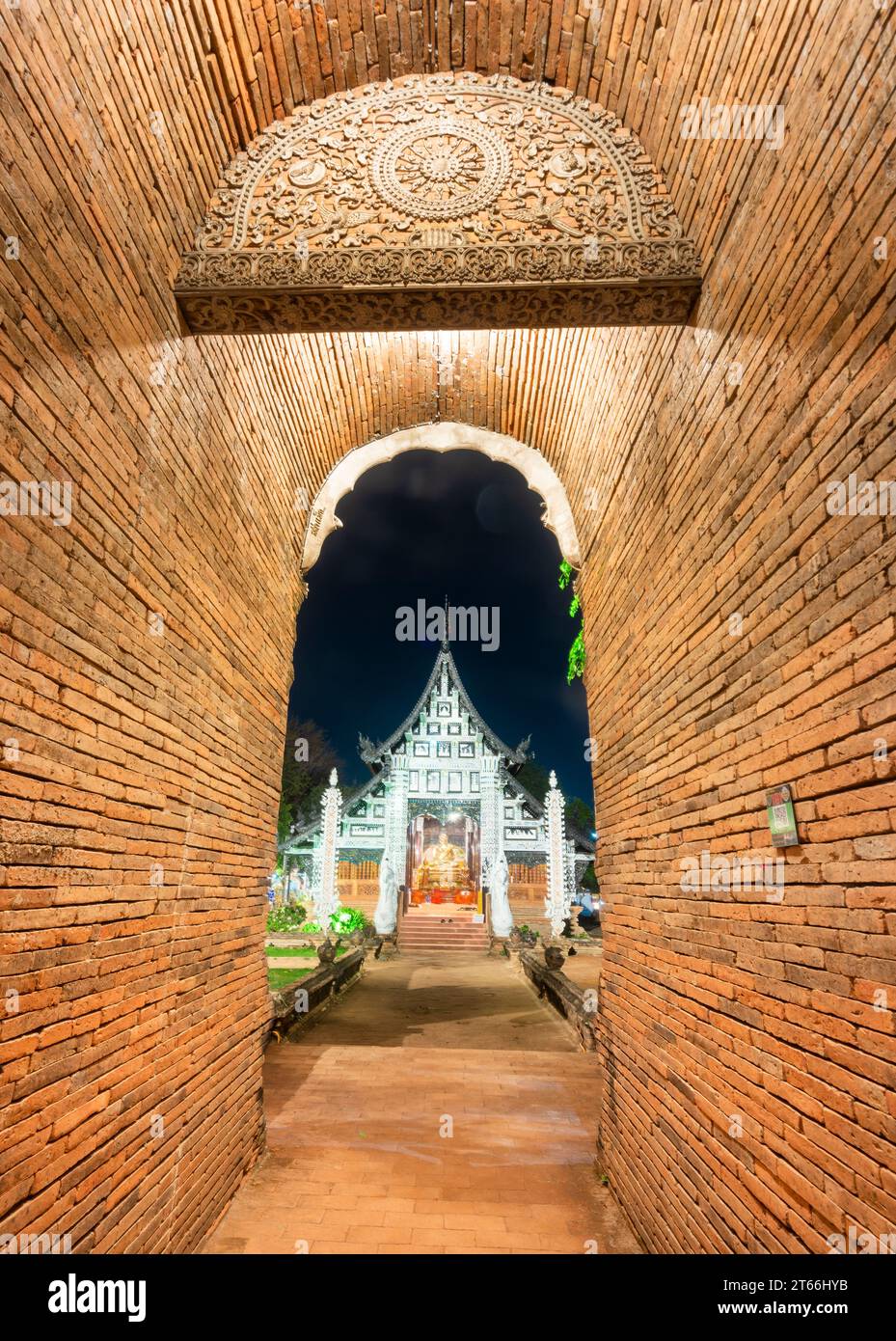 Tall, narrow, arched, short tunnel,lined with red brickwork,leading ...