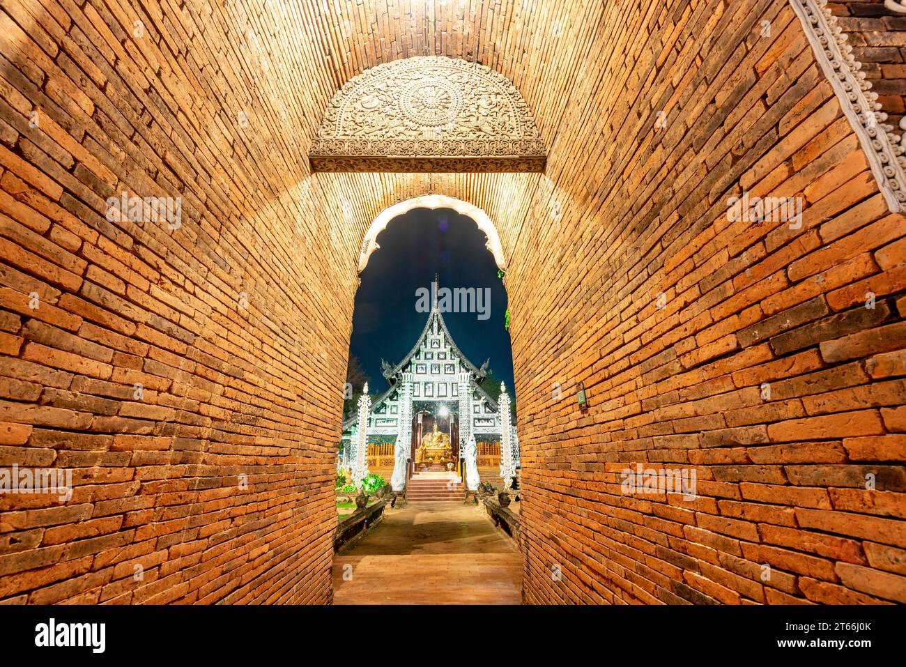 Tall, narrow, arched, short tunnel,lined with red brickwork,leading ...