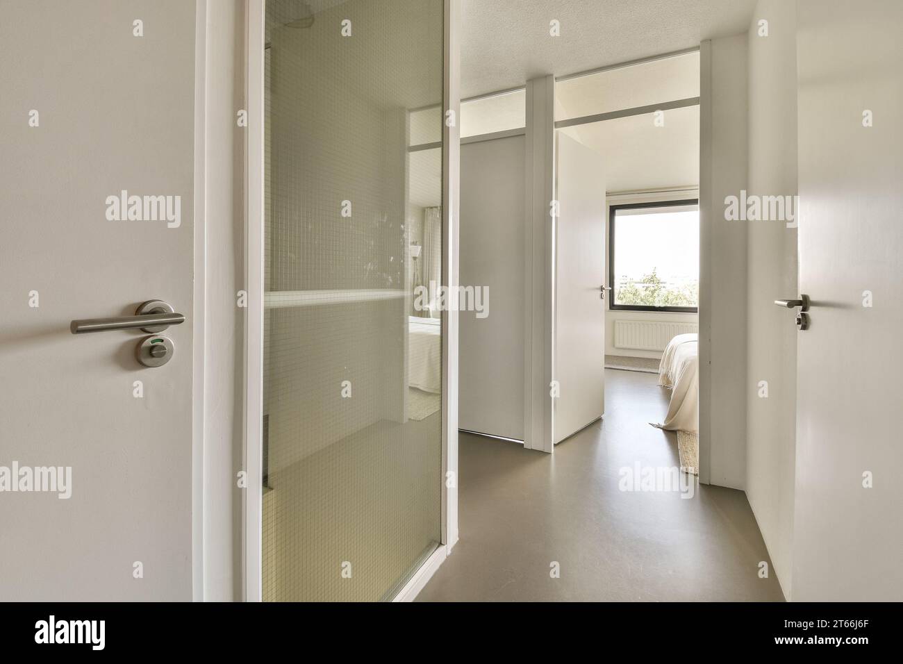 a bathroom with a shower and toilet in the corner, as seen through an ...